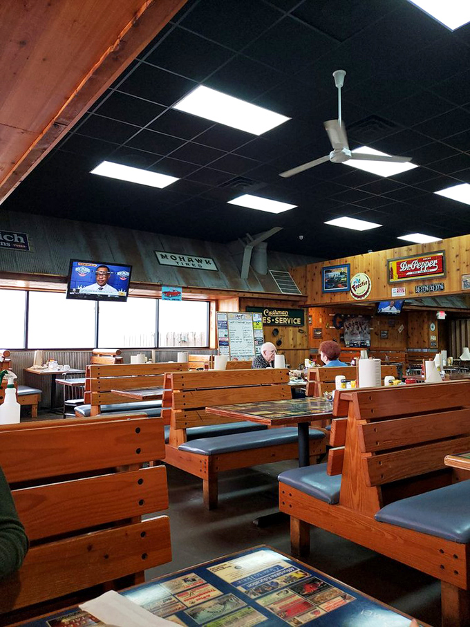 Wooden booths worn smooth by decades of diners create that perfect "everybody knows your order" atmosphere where comfort food meets comfort seating.