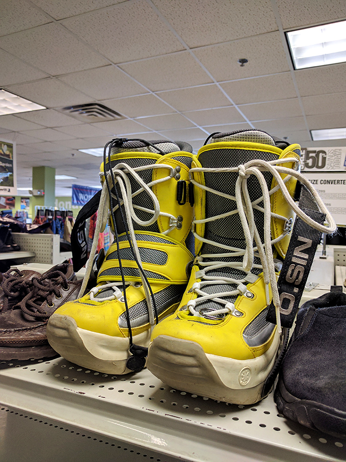 Bright yellow snowboarding boots stand ready for powder days&mdash;because Vermont winter gear at thrift prices means more money for apr&egrave;s-ski beverages.