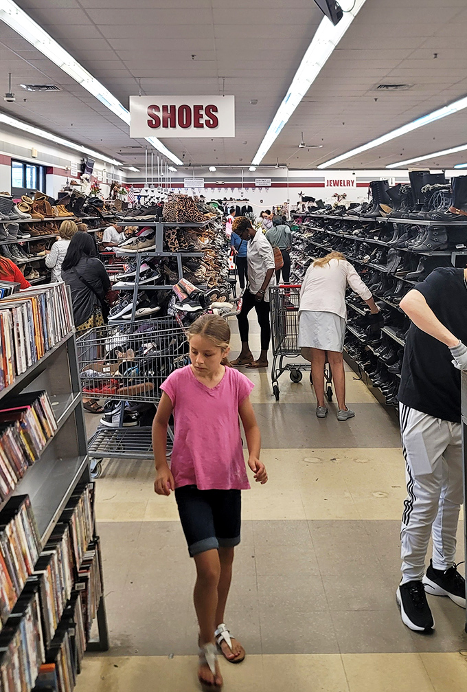 The thrill of the hunt brings shoppers of all ages together. This busy shoe section proves that bargain hunting is Connecticut's favorite indoor sport.