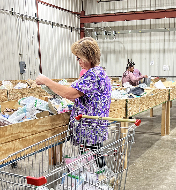 Serious shoppers in their natural habitat, methodically working the bins like professional gold panners during the rush of '49.