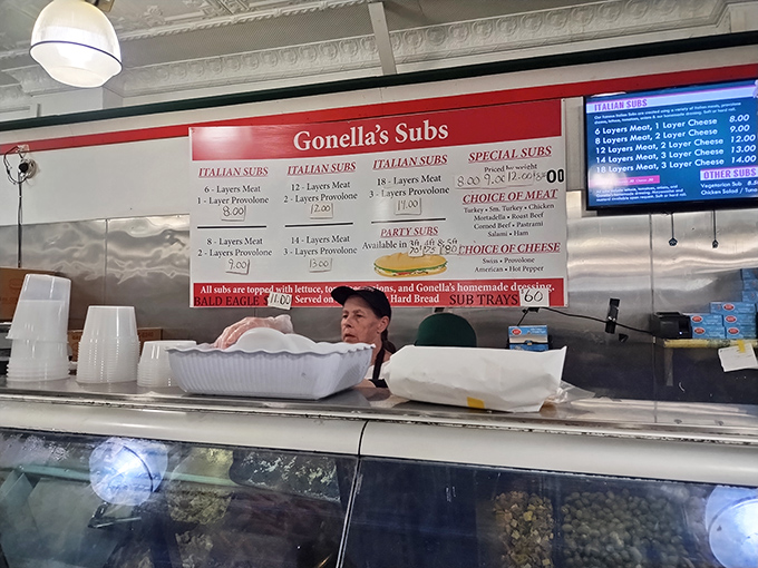 Hands that have made thousands of sandwiches move with the precision of surgeons and the confidence of conductors leading a delicious symphony.