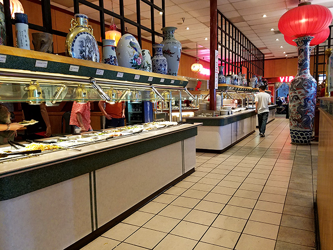 Decorative vases watch over the buffet stations like ancient guardians of a feast that spans generations of Chinese-American classics.
