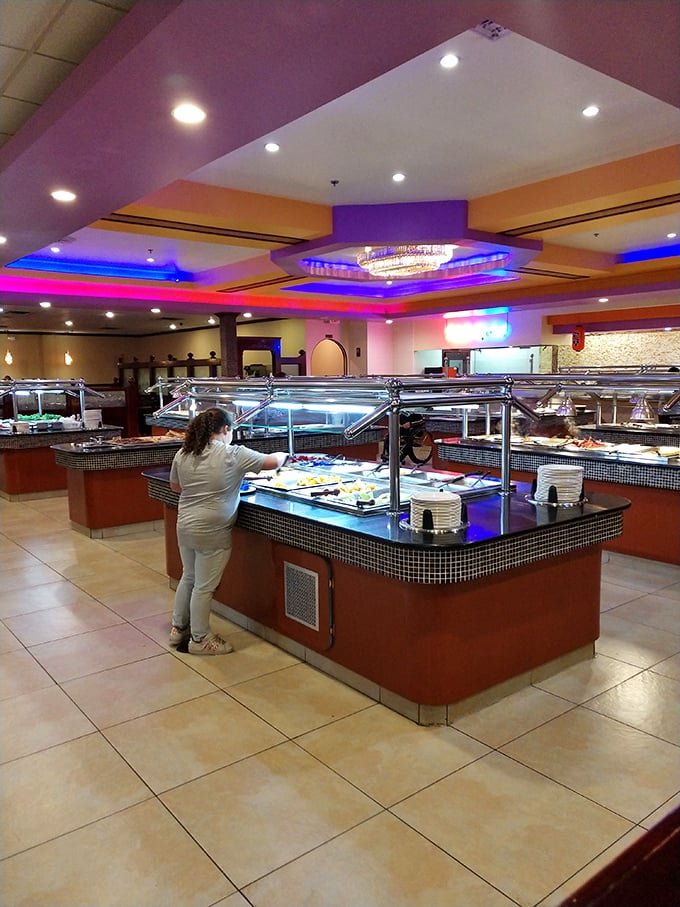 The buffet islands stretch into the distance like a food archipelago, with each station offering its own unique culinary landscape to explore.