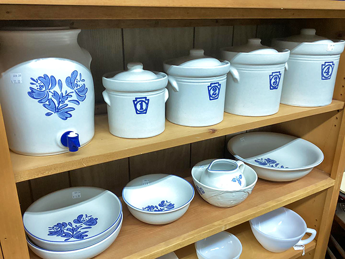 Blue and white stoneware that's survived decades of kitchen duty. These crocks have probably held everything from pickles to pennies with equal dignity.