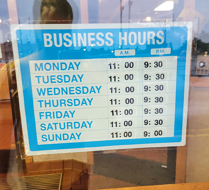 The hours posted like a promise: open seven days a week, because hunger doesn't take weekends off in Michigan's capital city.
