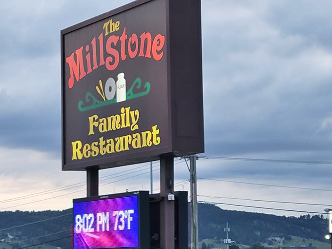 The Millstone sign stands proud against South Dakota skies, a colorful beacon promising good food and zero pretension to weary travelers.