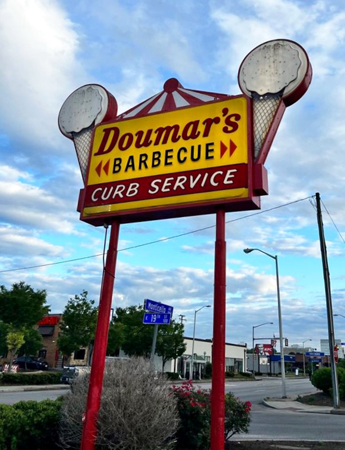 The roadside sign with ice cream cone finials stands as a beacon of hope for empty stomachs and sweet tooths alike.