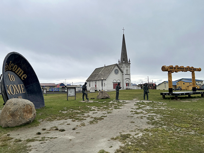 Old St. Joseph's Church stands sentinel beside Nome's welcome sign, greeting visitors to this edge-of-the-world community.