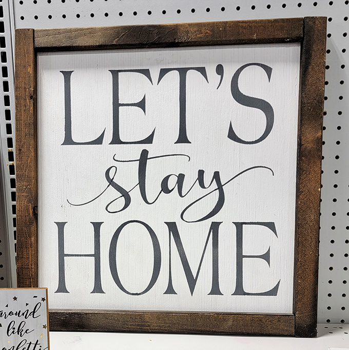 "Let's Stay Home" proclaims the sign that someone ironically left home, a philosophical puzzle available for just a few dollars.