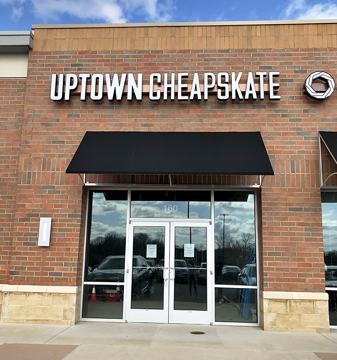 Uptown Cheapskate's brick facade and black awning signal this isn't your grandma's thrift store—it's resale with attitude.