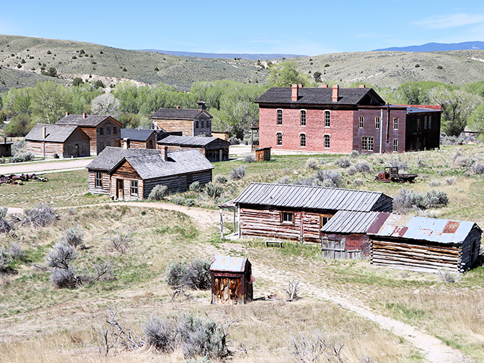 Bannack's ghost town buildings stand in sun-bleached dignity, silently recalling the boom-and-bust cycle that defined the West long before tech startups.