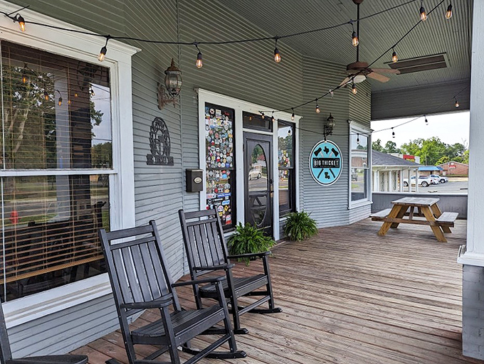 Big Thicket BBQ's porch invites you to rock away your troubles while the ceiling fans spin stories of slow-cooked meats and unhurried afternoons.