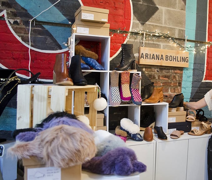 Ariana Bohling's footwear display: where boots and fuzzy slippers coexist in harmony. Your feet deserve this kind of thoughtful curation.