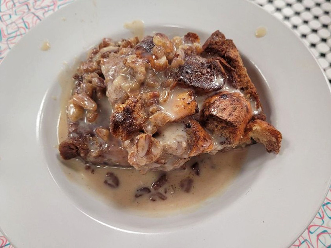 This bread pudding isn't just dessert; it's a sweet, custardy time machine to your grandmother's kitchen, swimming in buttery sauce.