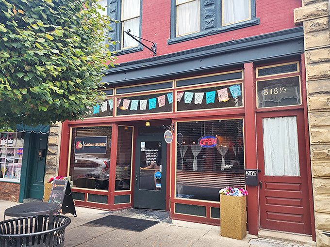Colorful papel picado flags dance above Casa De Leones. Mexican flavors in Appalachia prove good taste knows no geographical boundaries.