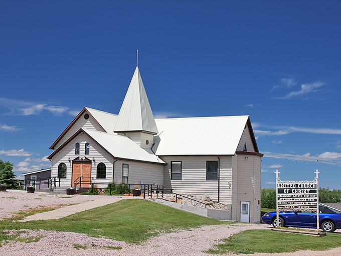 This charming white church isn't just a building—it's the spiritual center where community happens beneath that impossibly blue Dakota sky.