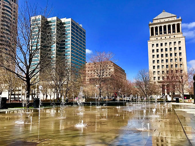 Citygarden's fountains create an urban oasis where office workers escape for lunch and children dash through water on hot summer days.