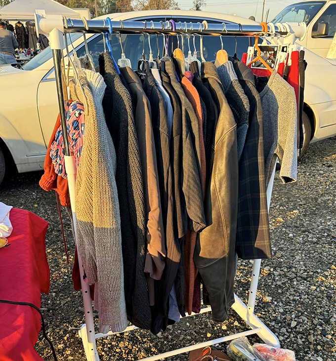 The clothing rack time machine &ndash; where vintage sweaters and modern jackets hang together in perfect harmony, waiting for their next chapter.