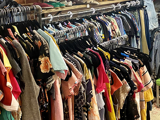 The clothing racks: where fashion history hangs in colorful rows, waiting for someone to give these garments their second act.