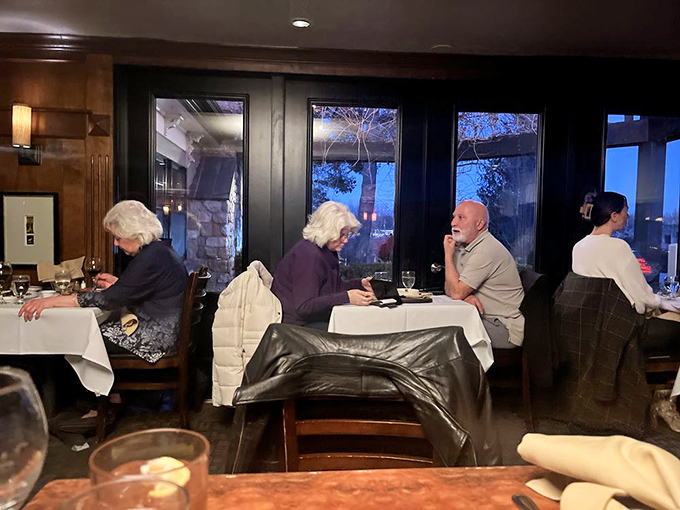 The dining room hums with conversation&mdash;each table hosting its own private celebration of food, friendship, and the simple joy of breaking bread together.