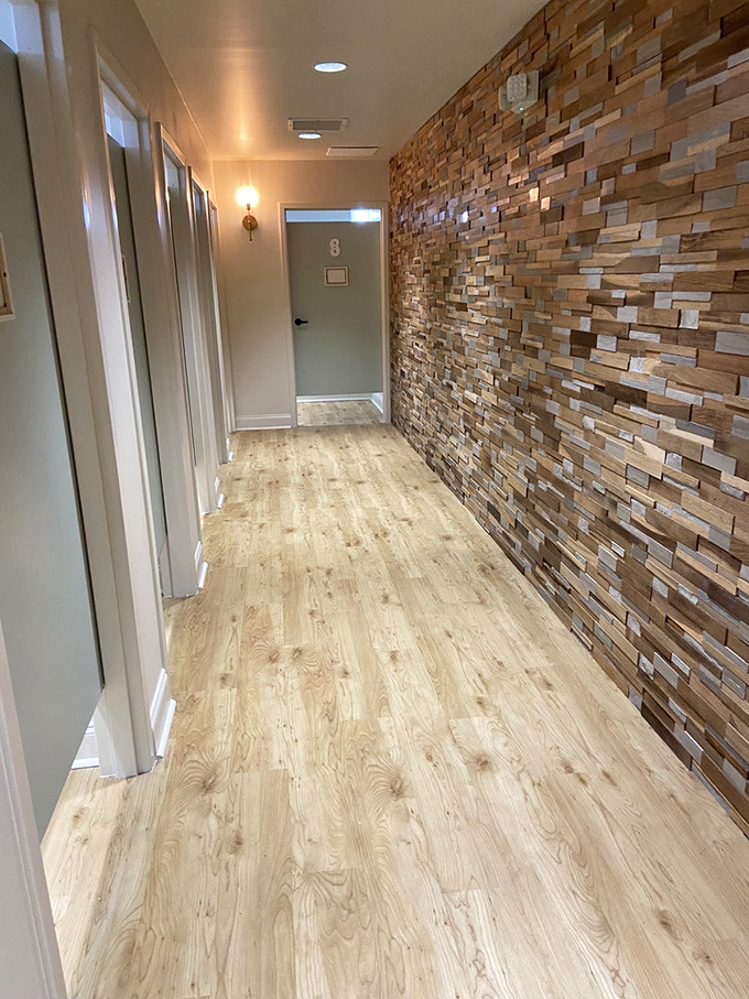 Even the dressing room hallway feels upscale with its textured wood wall, proving secondhand shopping doesn't have to feel second-rate.