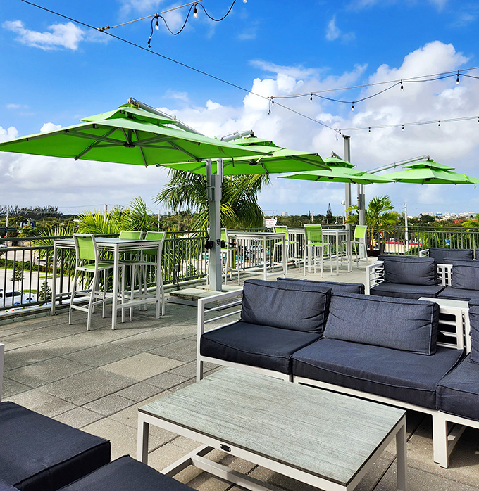 A rooftop oasis with green umbrellas where you can unwind after a successful day of antiquing adventures.