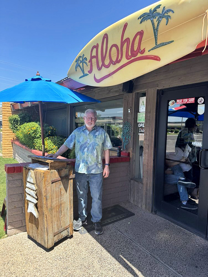 The "Aloha" surfboard welcomes visitors like an old friend, proving that island vibes can thrive even in the Arizona heat.