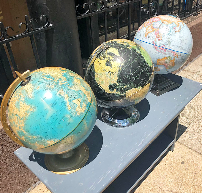 Vintage globes showing borders long changed&mdash;geography lessons and decorative statements rolled into perfect spheres of nostalgia.