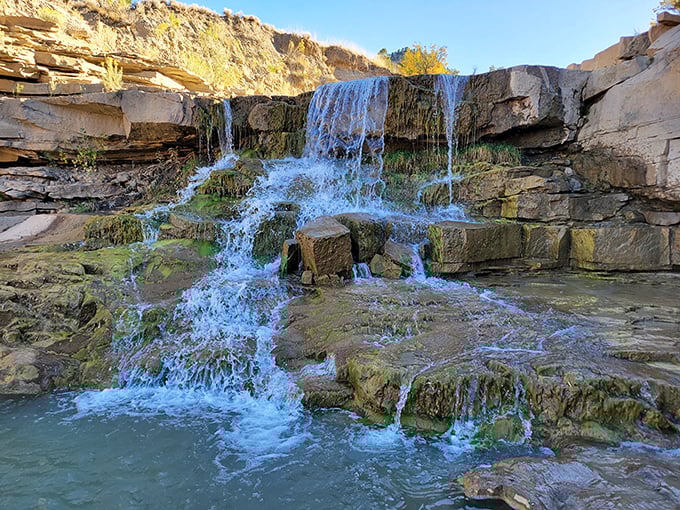 Gordon Creek Falls cascades over ancient stone steps, creating nature's perfect soundtrack for a moment of zen amid Utah's rugged landscape.