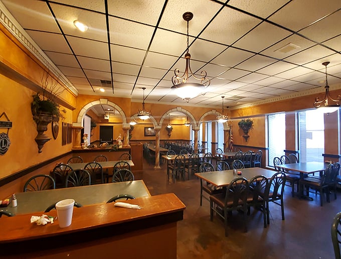 Grecian Steak House's warm interior promises hearty meals served with genuine hospitality, not manufactured corporate smiles.