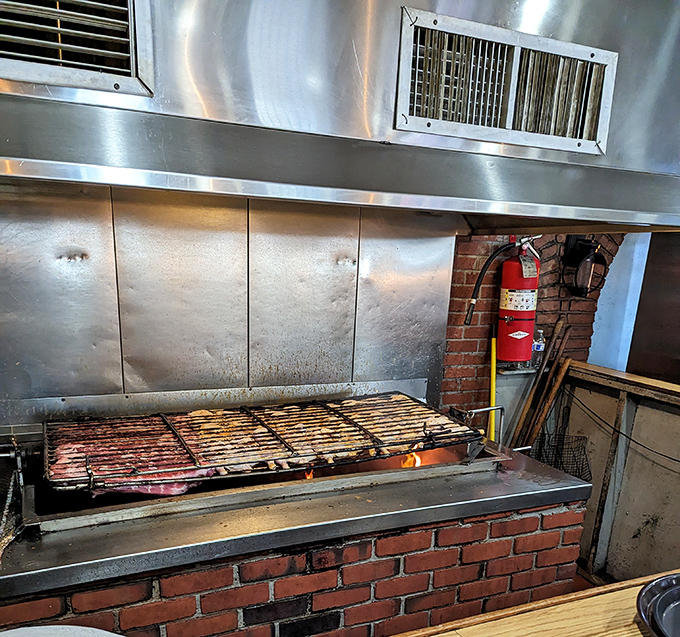 The heart of the operation&mdash;where fire meets meat. This brick-lined grill has probably seen more perfect sears than a steakhouse critic.