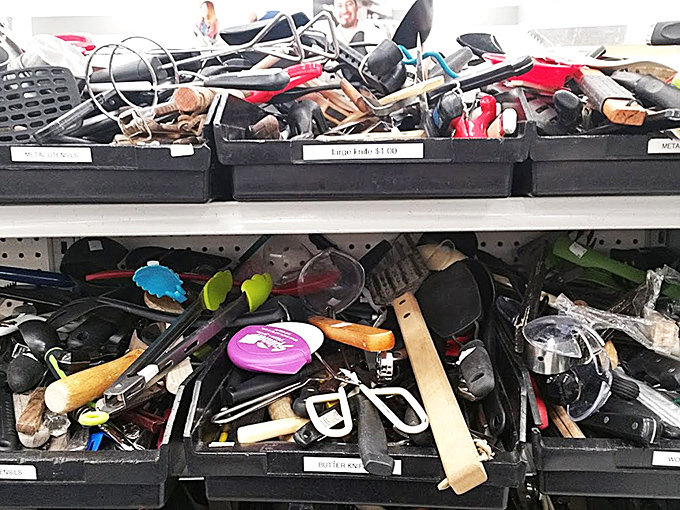 Kitchen tool archaeological dig! Somewhere in this utilitarian jumble lies the perfect potato masher someone's grandmother swore by.