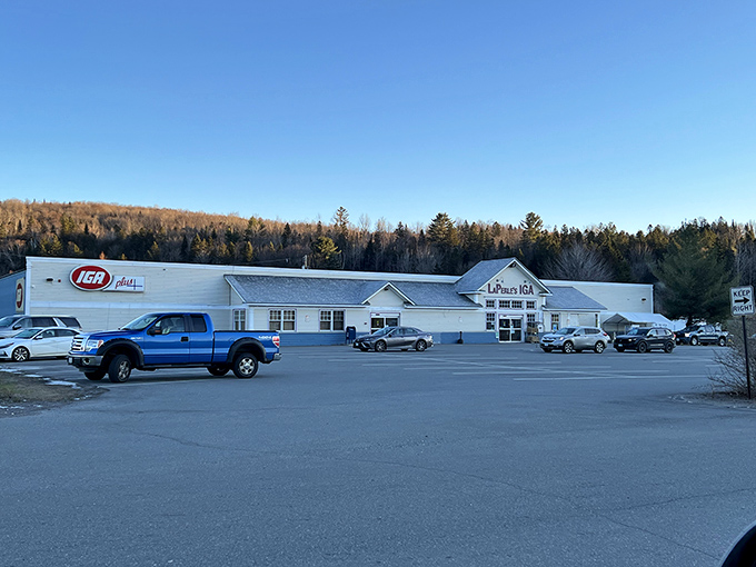 LaPerle's IGA provides essentials without big-box anonymity. Where else might the cashier ask about your garden while bagging your groceries?