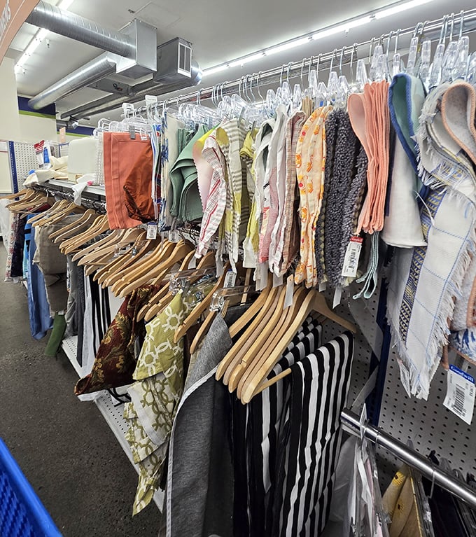 Textile treasures hang in orderly rows, where savvy shoppers can refresh their linen closets and wardrobe basics for pocket change.