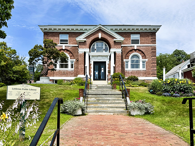The Littleton Public Library's brick facade and manicured grounds &ndash; where literary adventures begin in architectural splendor.