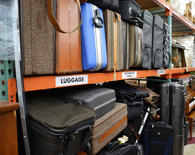 The luggage section tells stories of travels past. That vintage Samsonite has probably seen more of the world than most of us.