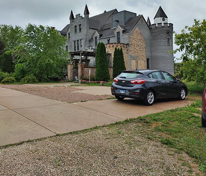 Modern cars parked beside ancient stonework create the most delightfully surreal Illinois juxtaposition you'll ever witness.