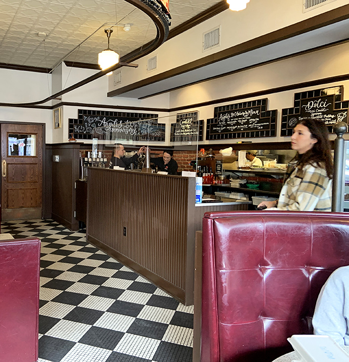 Where culinary magic happens—the open preparation area lets you witness the choreographed chaos behind perfect plates.