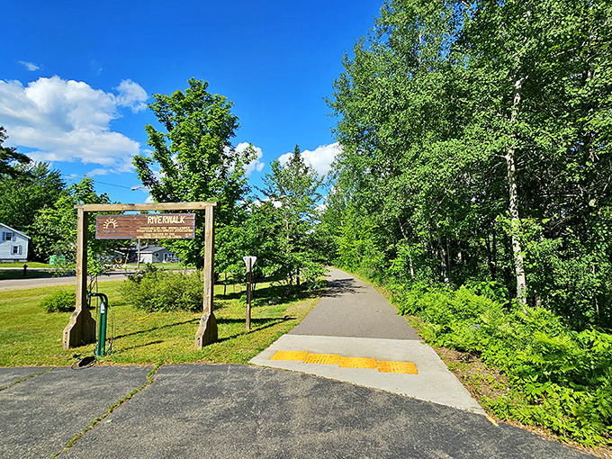 The Riverwalk Trailhead beckons with promises of gentle adventure and Northwoods serenity. No mountain-climbing skills required.
