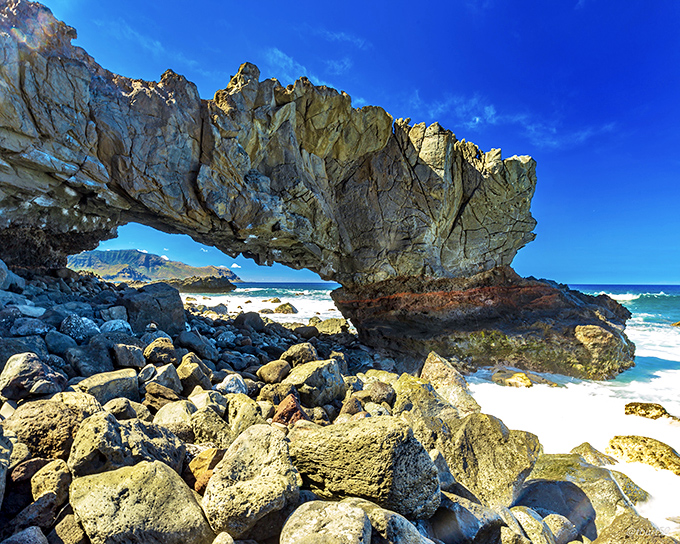 Nature's own stone arch&mdash;a geological masterpiece sculpted by waves with the patience only the ocean possesses.