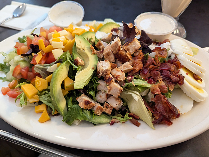 A salad that doesn't apologize for being hearty—loaded with avocado, bacon, and chicken, it's Minnesota's answer to "eating light."