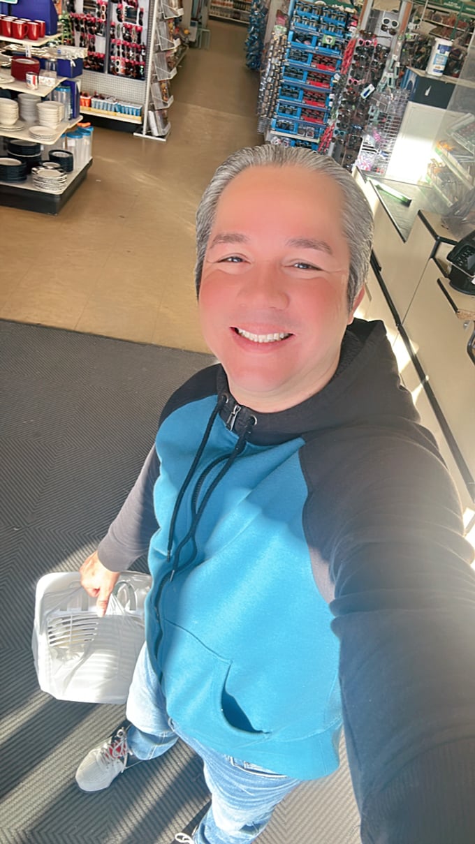 The universal expression of dollar store triumph: that smile that says "I just got way more stuff than I should reasonably be able to afford."