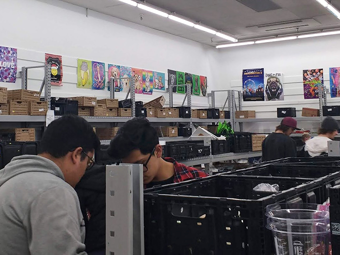 Treasure hunters in their natural habitat, diving deep into bins where retail therapy meets actual therapy for your bank account.