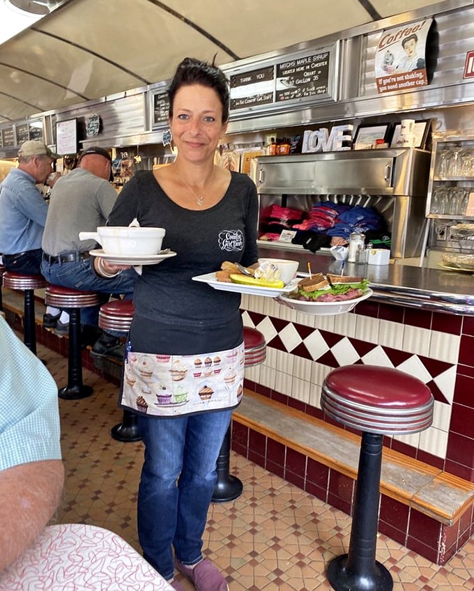 Service with a genuine smile &ndash; carrying plates loaded with the kind of food that makes you feel instantly at home.