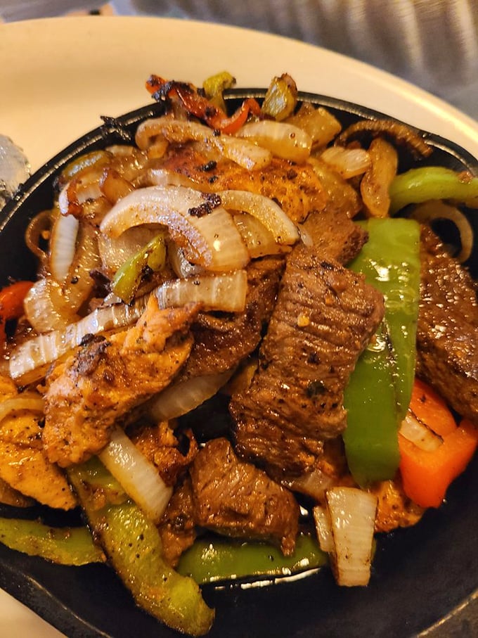 Sizzling fajitas with perfectly charred peppers and onions&mdash;the dish that announces its arrival to the entire restaurant with that signature sound.
