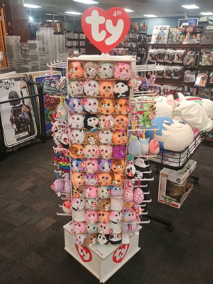 A tower of tiny faces stares out with button eyes. These Ty plushies have found temporary shelter while waiting for their forever homes.