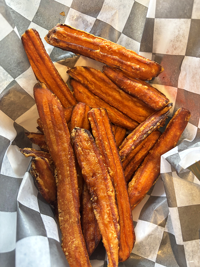 Sweet potato fries that achieve the impossible: crispy exteriors giving way to tender, sweet interiors. The perfect sidekick to any burger adventure.