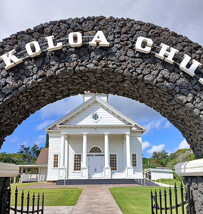 The historic Koloa Church stands framed by its volcanic rock archway&mdash;a picture-perfect reminder of Hawaii's unique blend of natural beauty and cultural heritage.