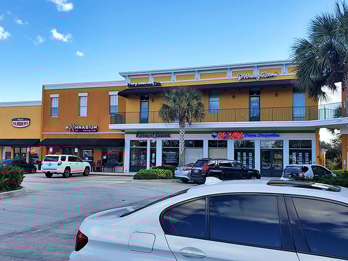 The Shoppes at Windward Cay blend Florida's signature yellow-orange architecture with palm trees, creating that quintessential Sunshine State shopping experience.