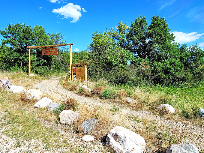 The entrance to Turtle Mountain Recreation Area promises adventures that won't make your Instagram famous but will make your soul happy.